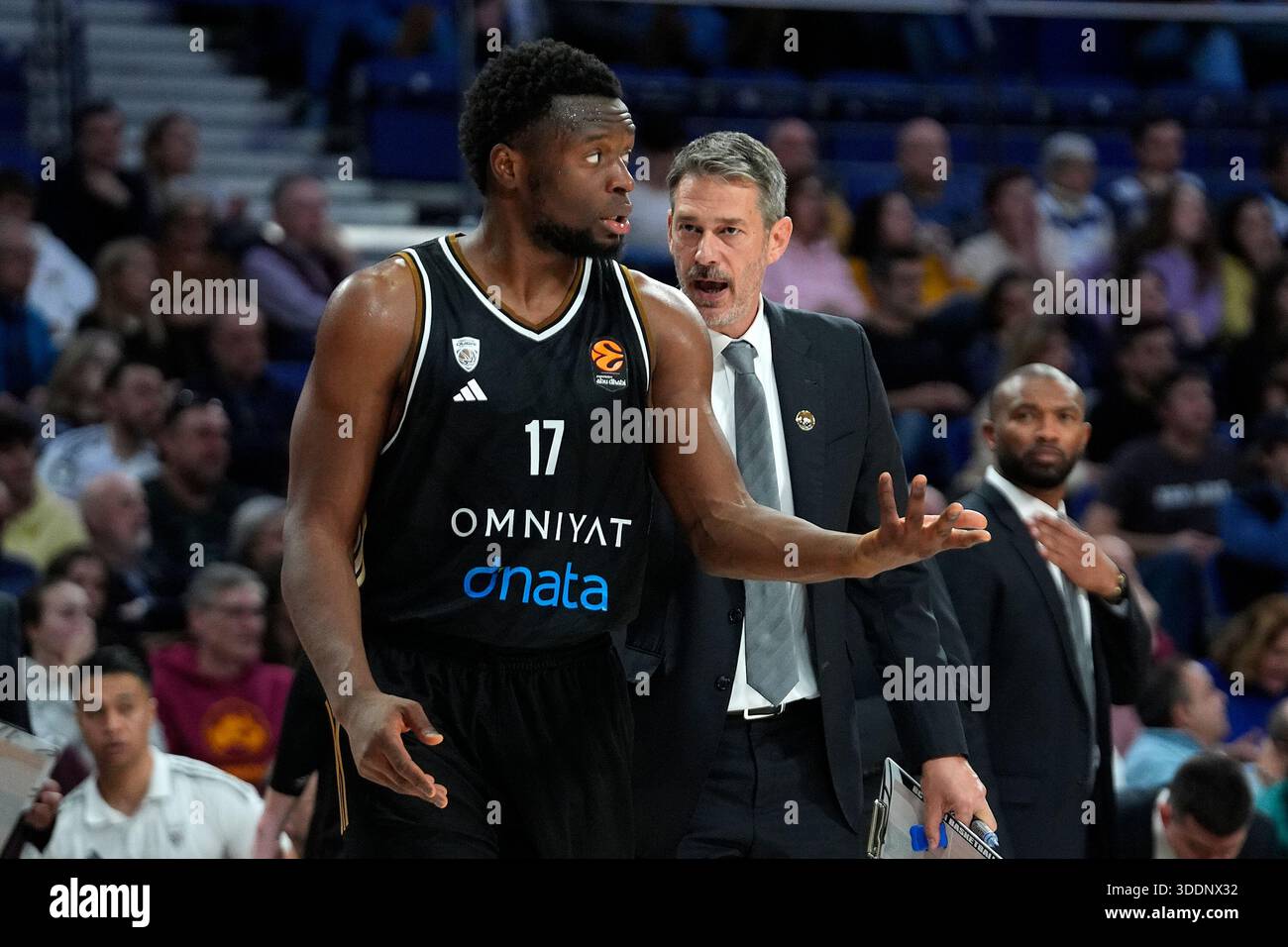 Dubai Basketball's coach Jurica Goleman with his player Mfiondu ...