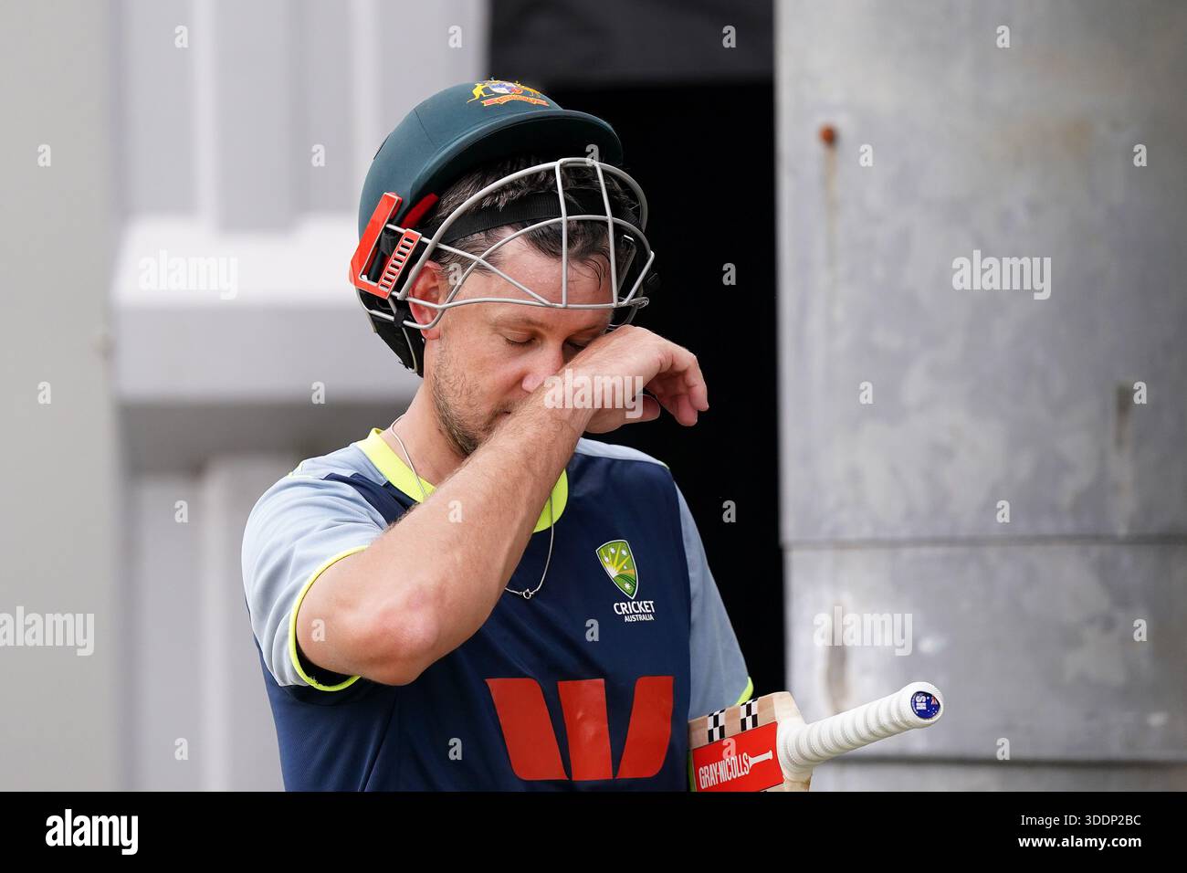 Australia's Beau Webster wipes his eye during a nets session at the ...