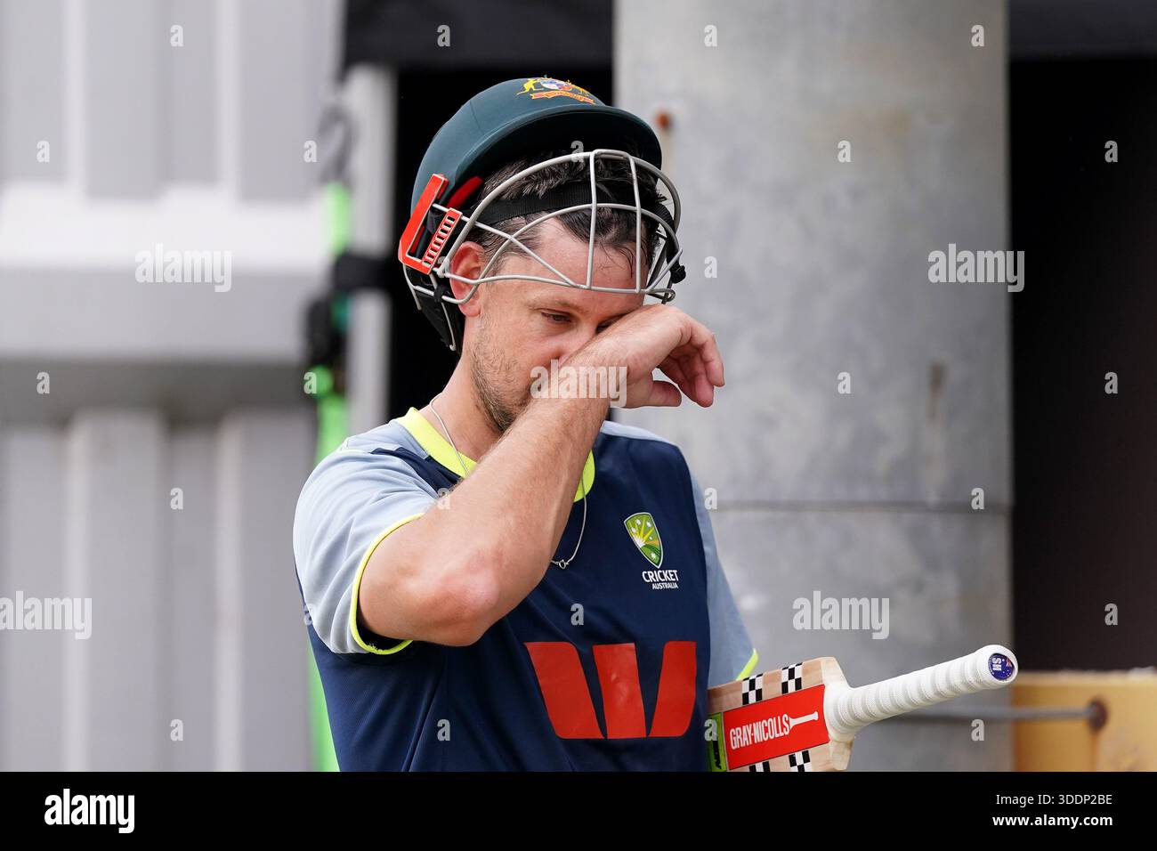 Australia's Beau Webster wipes his eye during a nets session at the ...