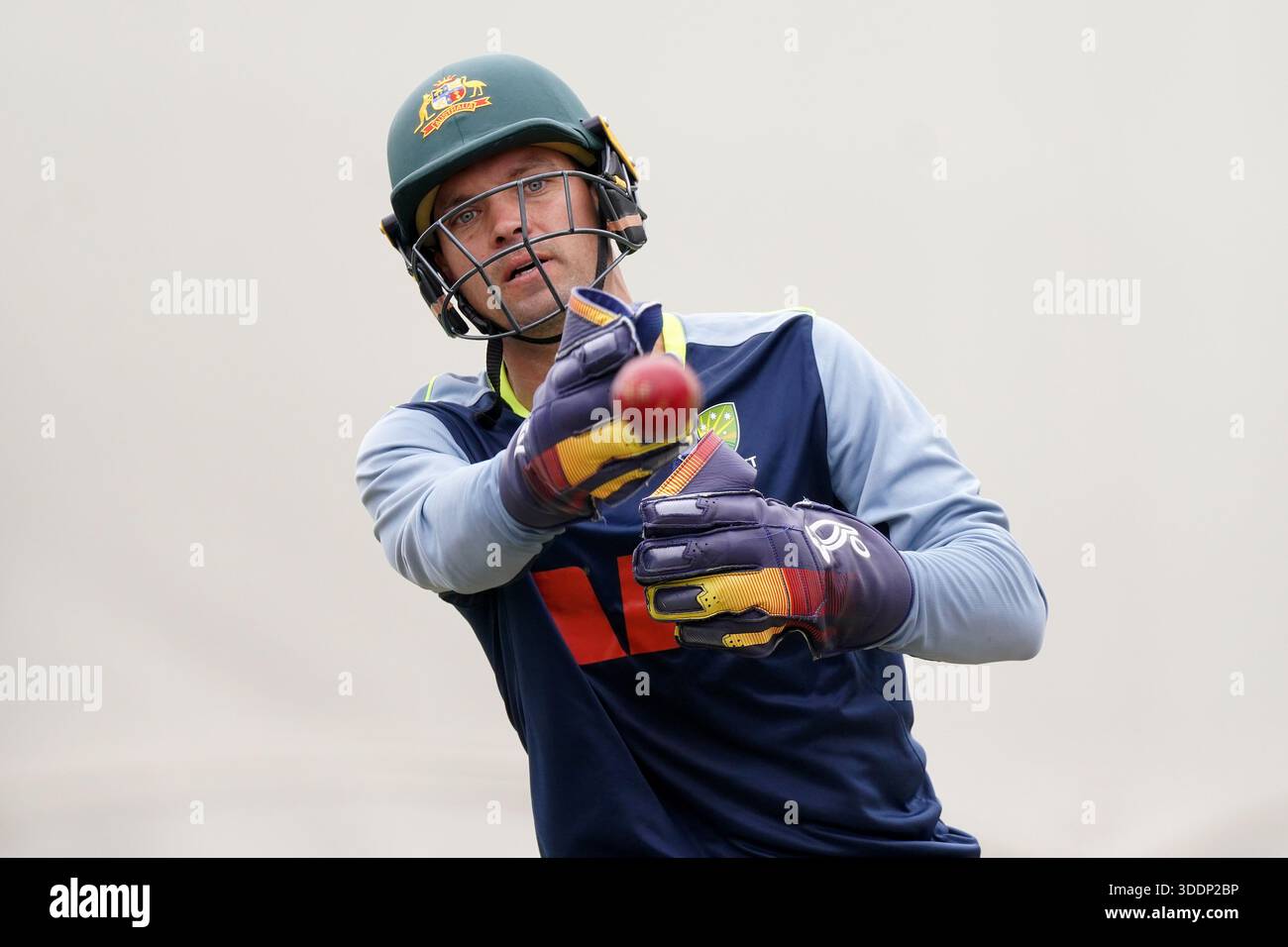 Australia's Alex Carey practices his wicket keeping during a nets ...