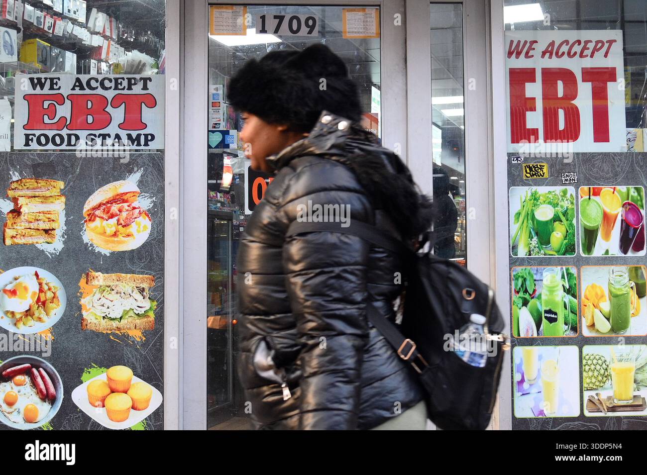 A store displays a sign accepting Electronic Benefits Transfer (EBT ...