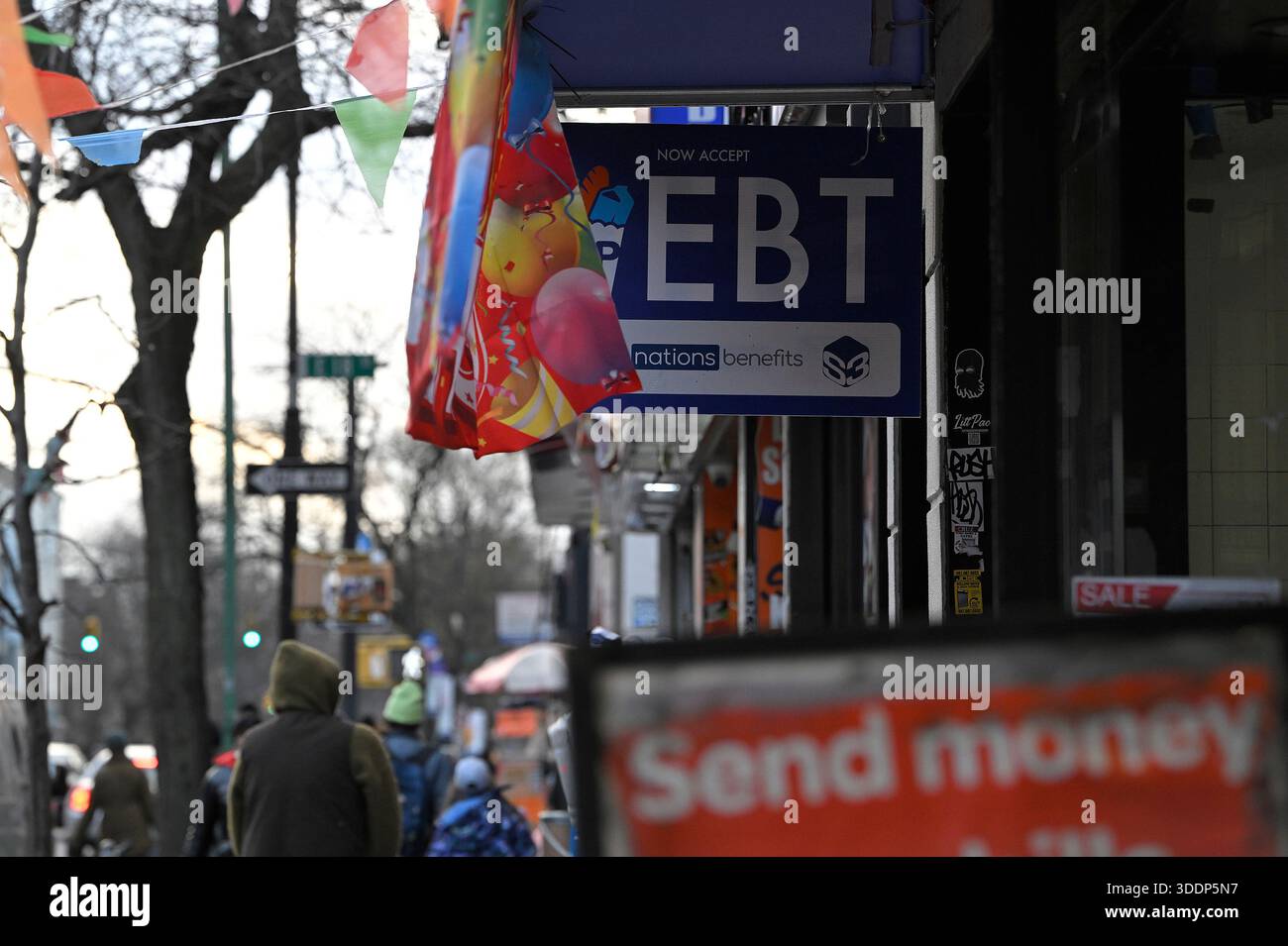 A store displays a sign accepting Electronic Benefits Transfer (EBT ...
