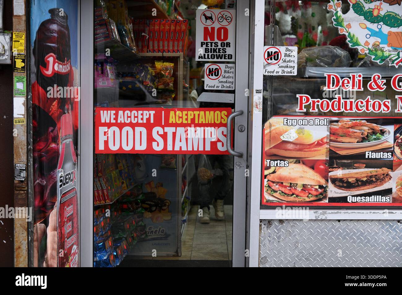 A store displays a sign accepting Electronic Benefits Transfer (EBT ...