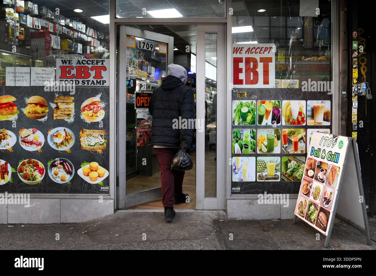 A store displays a sign accepting Electronic Benefits Transfer (EBT ...