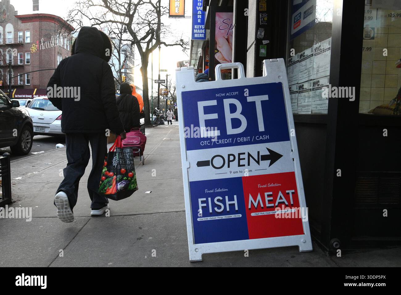 A store displays a sign accepting Electronic Benefits Transfer (EBT ...