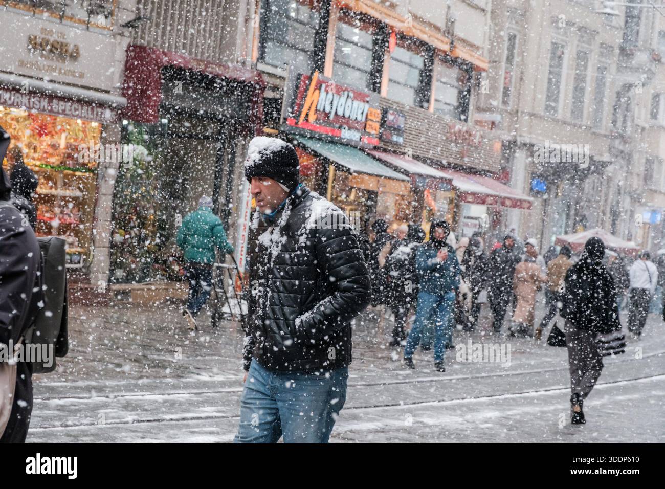 People seen walking in heavy snowfall. On the first day of the new year ...