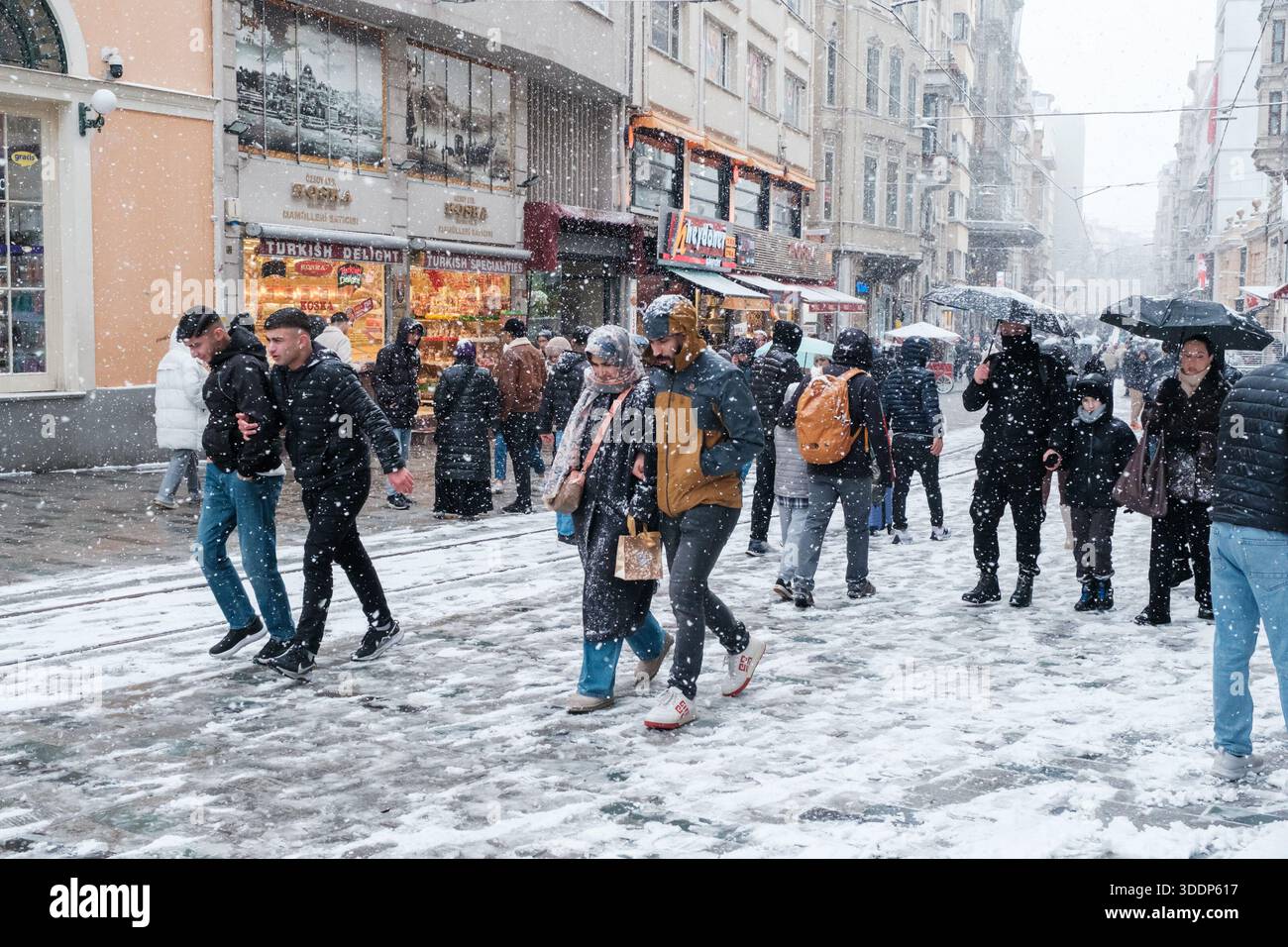 People seen walking in heavy snowfall. On the first day of the new year ...