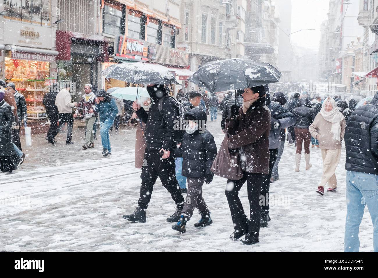 People seen walking in heavy snowfall. On the first day of the new year ...