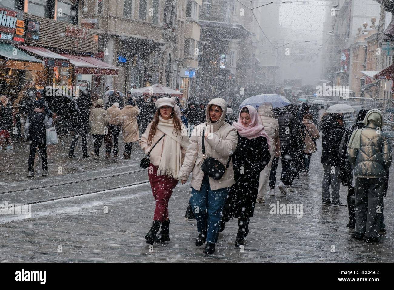 People seen walking in heavy snowfall. On the first day of the new year ...