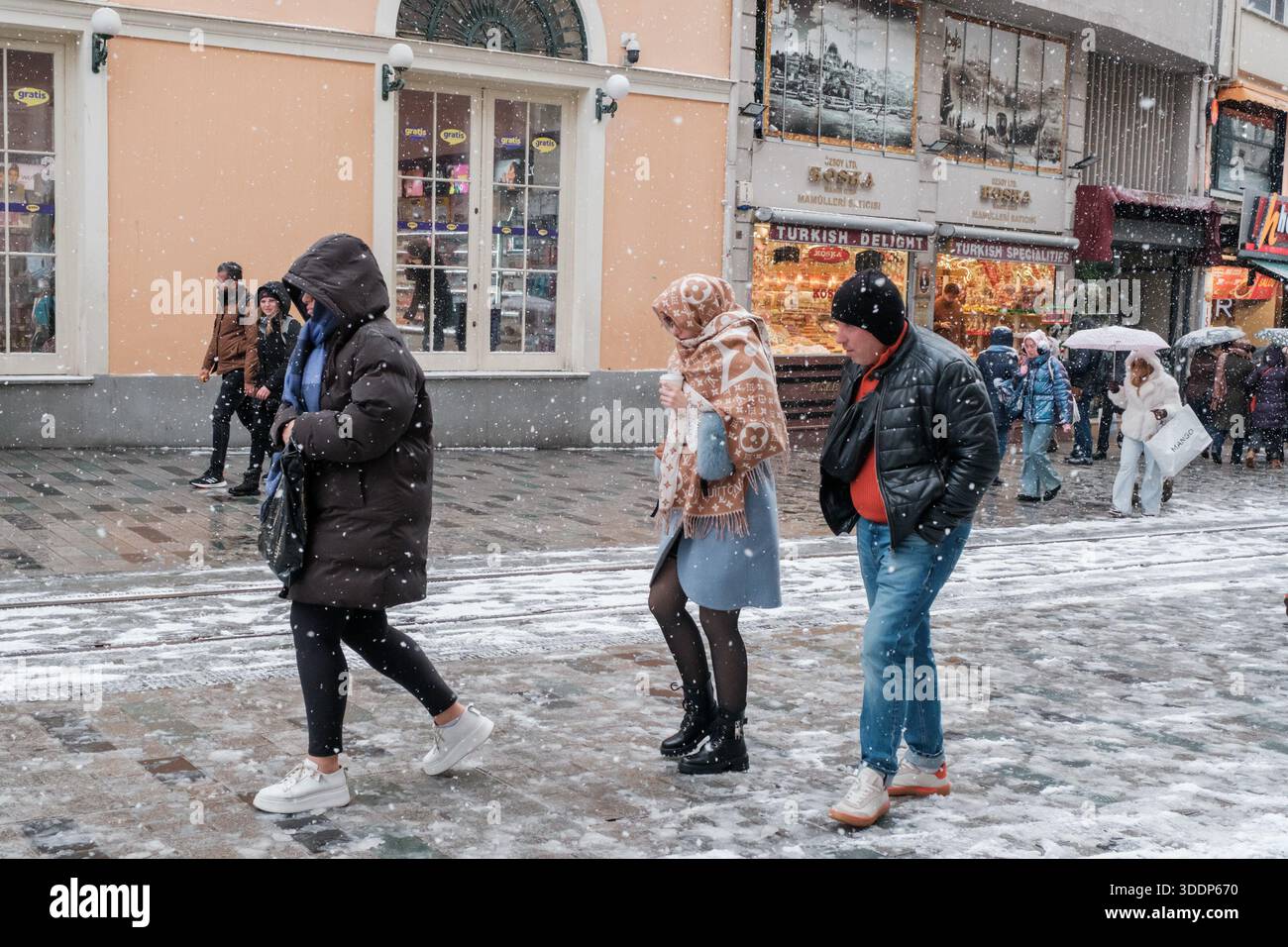 People seen walking in heavy snowfall. On the first day of the new year ...