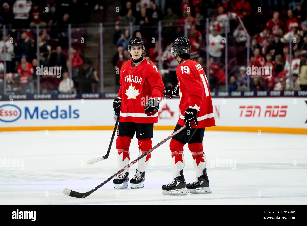 Canada's Michael Misa (7) celebrates his goal with teammate Zayne ...