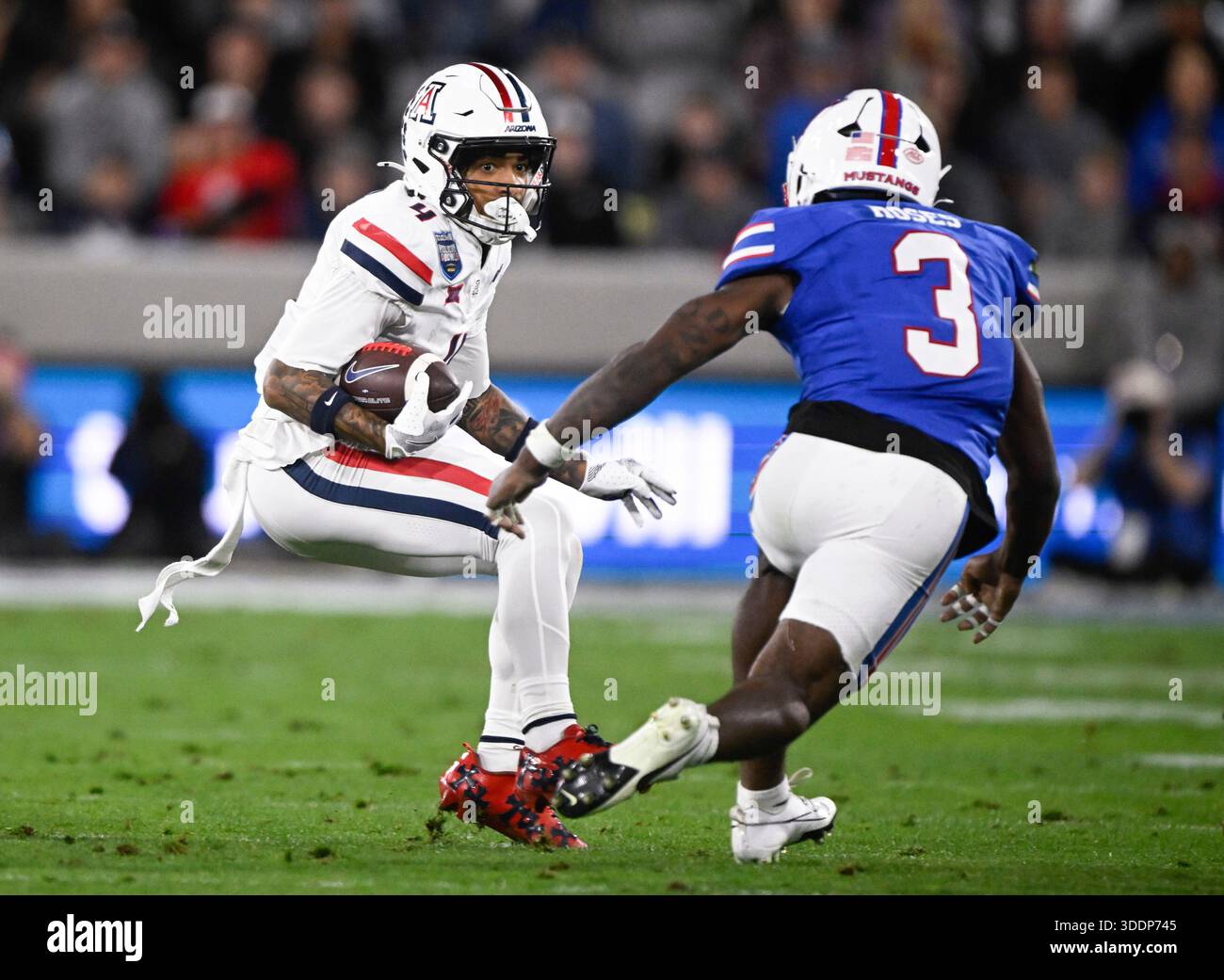 Arizona wide receiver Kris Hutson (4) tries to get past SMU safety ...