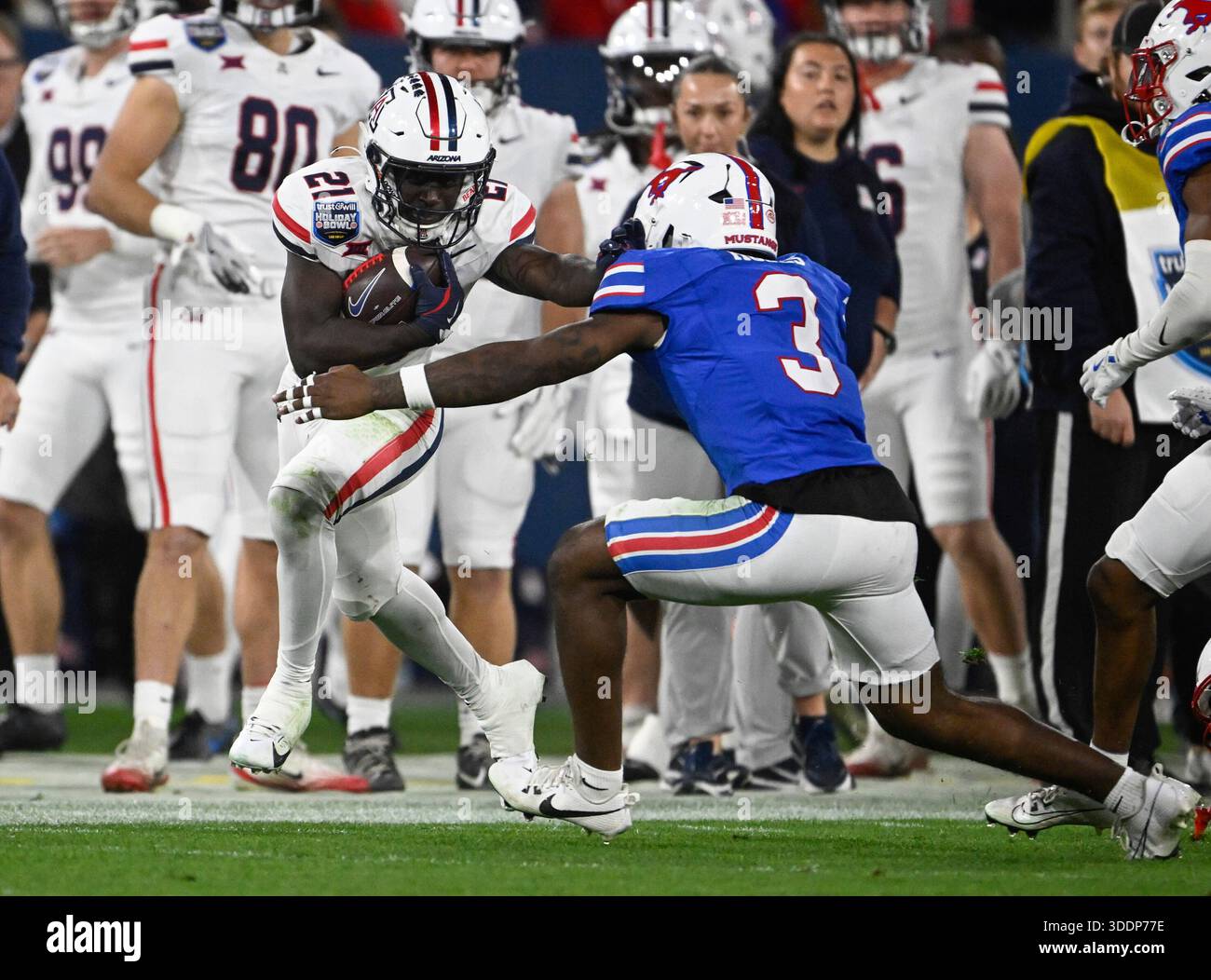 Arizona running back Ismail Mahdi (21) stiff-arms safety Ahmaad Moses ...