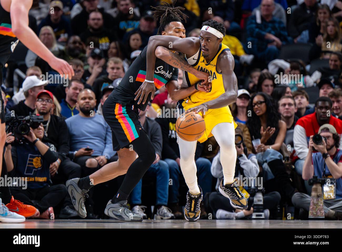 San Antonio Spurs guard Stephon Castle, left, attempts to stop a drive ...