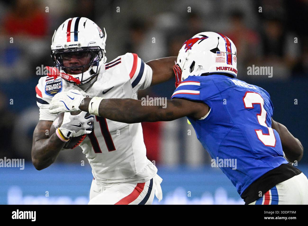 Arizona wide receiver Chris Hunter (11) tries to break a tackle by SMU ...