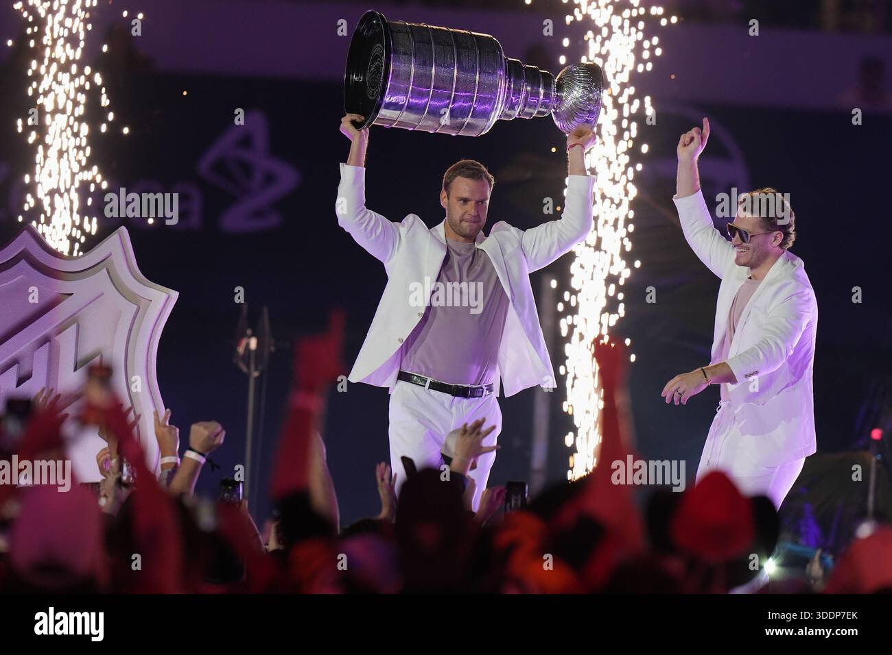 Florida Panthers's Matthew Tkachuk, left, and Aleksander Barkov hold up ...