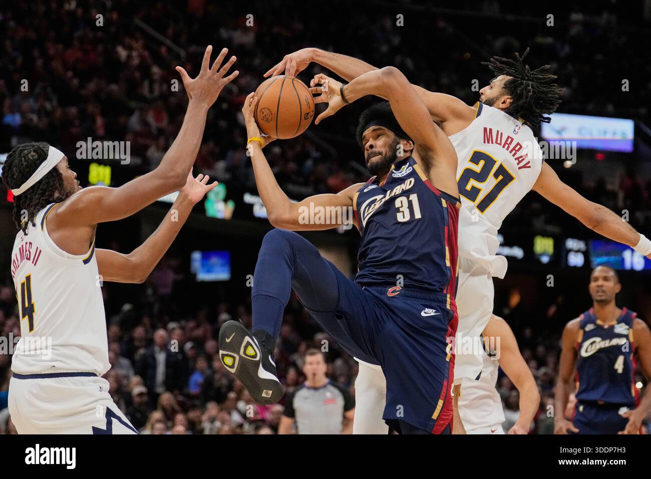 Cleveland Cavaliers center Jarrett Allen (31) reaches for a rebound ...