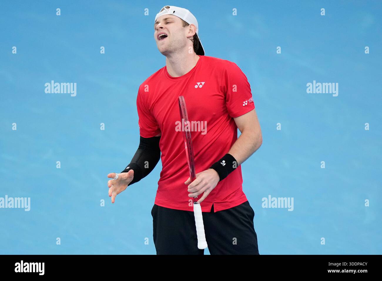 Zizou Bergs of Belgium throws his head back after losing a point to ...