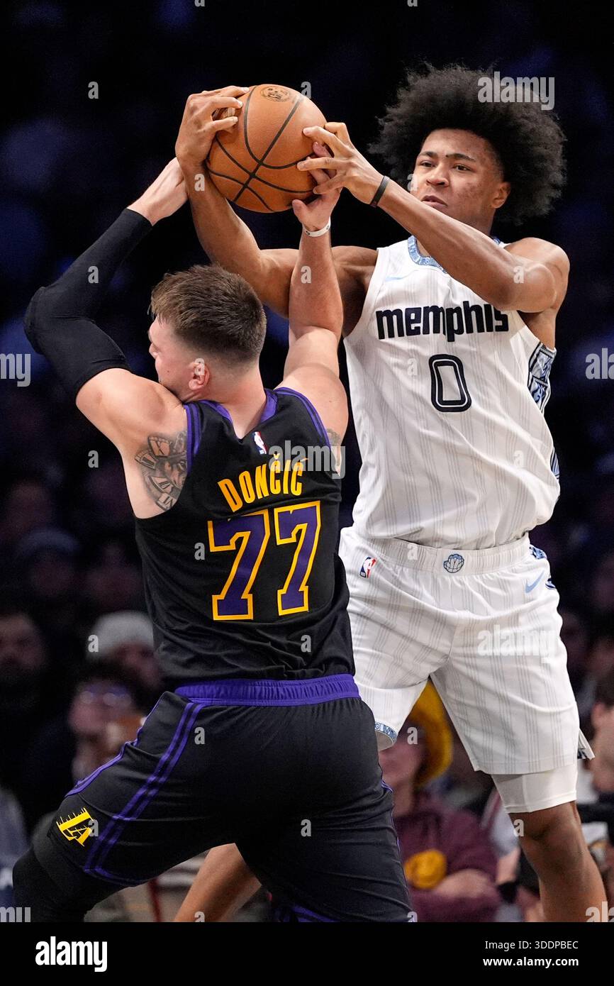 Los Angeles Lakers guard Luka Doncic, left, and Memphis Grizzlies ...