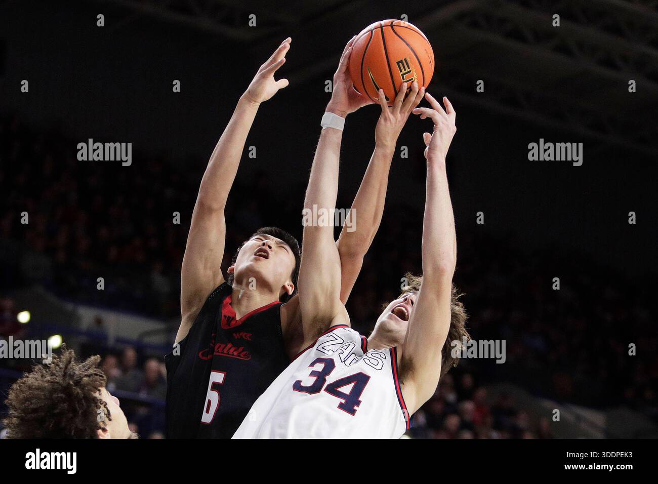 Seattle center Houran Dan (6) and Gonzaga forward Braden Huff (34) go ...