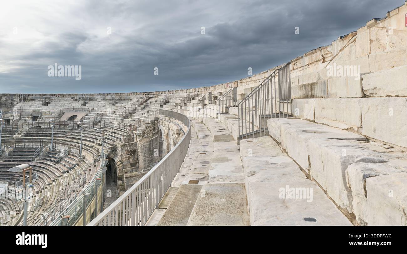 Upper cavea at the roman built ampitheatre at Nimes, France Stock Photo ...
