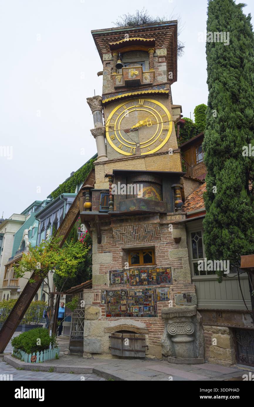 An old building with a big clock in a charming architectural style ...