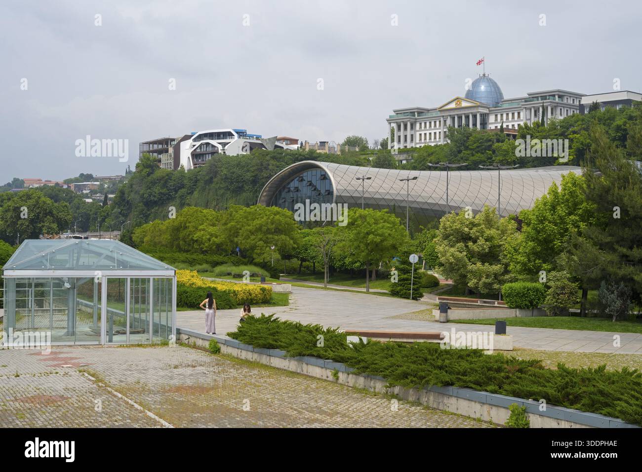 Glass-covered architecture in a park with green spaces, Rike Music ...