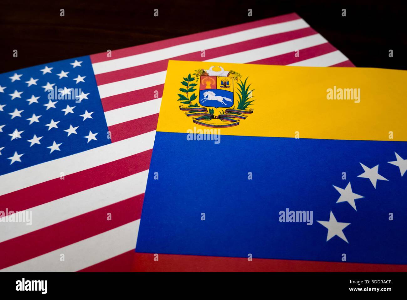 In this photo illustration, the American flag and the Venezuelan flag ...