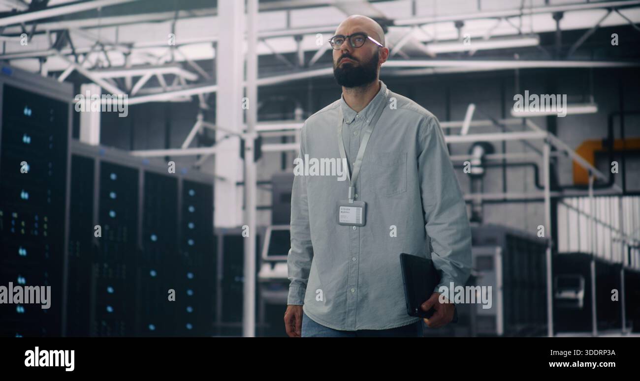 IT Engineer Walking Through Server Racks in Modern Data Center. Focused ...