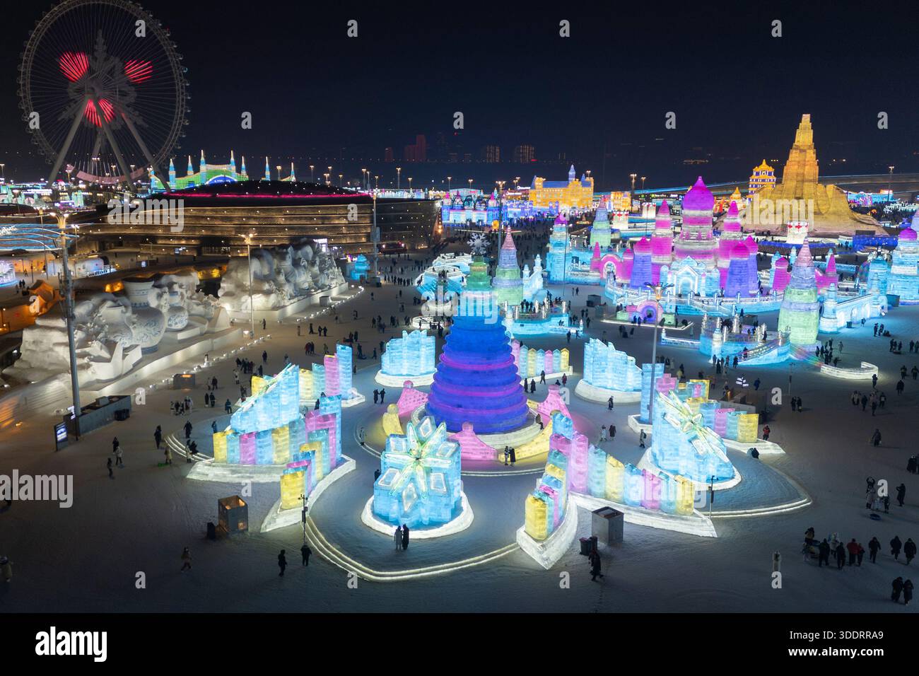 Attendees take in the sights at the annual Ice and Snow Festival held ...