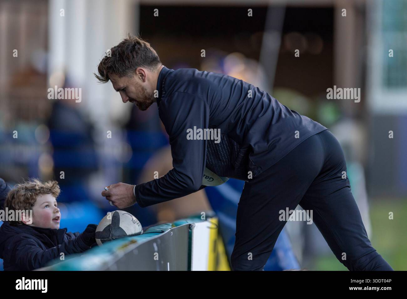 Exeter Chiefs Henry Slade signing autograph for fan During Gallagher ...