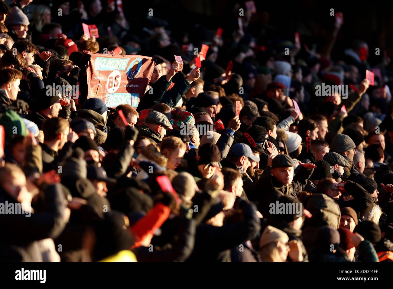West Ham United fans hold red cards in protest of club ownership during ...