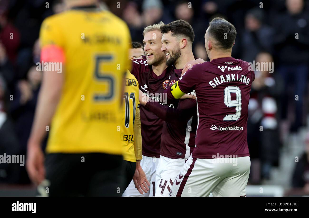Heart of Midlothian's Craig Halkett (second right) celebrates with his ...