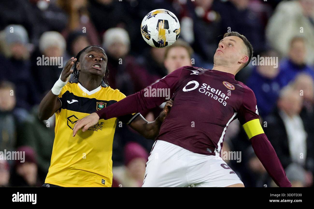 Livingston's Mahamadou Susoho (left) and Heart of Midlothian's Lawrence ...