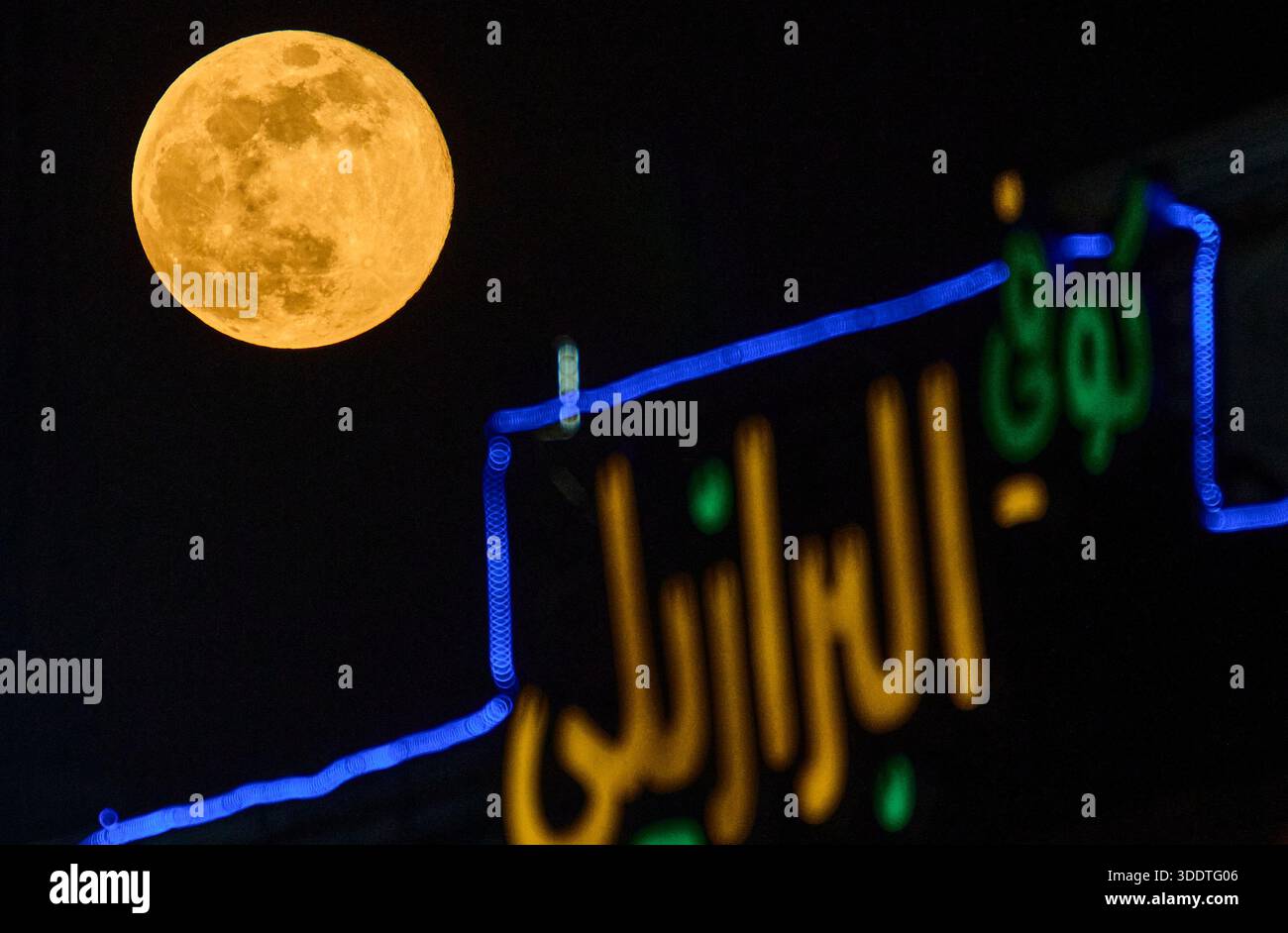 The full moon, known as the Wolf Supermoon, rises above Baghdad, Iraq ...