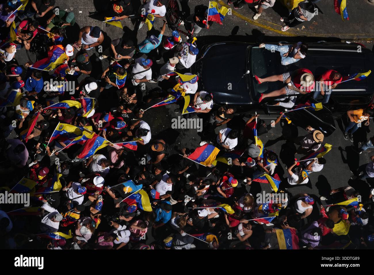 Venezuelans celebrate in Santiago, Chile, Saturday, Jan. 3, 2026, after ...