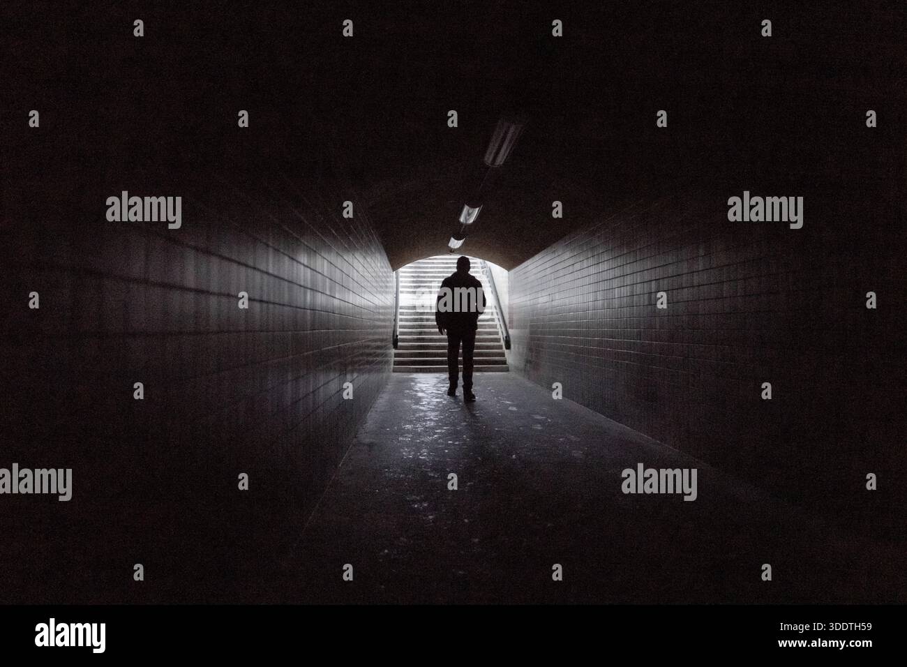 dpatop - 03 January 2026, Berlin: A woman walks through the tunnel at ...
