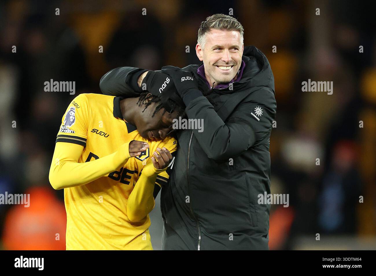 Wolverhampton Wanderers' Mateus Mane (left) with manager Rob Edwards ...