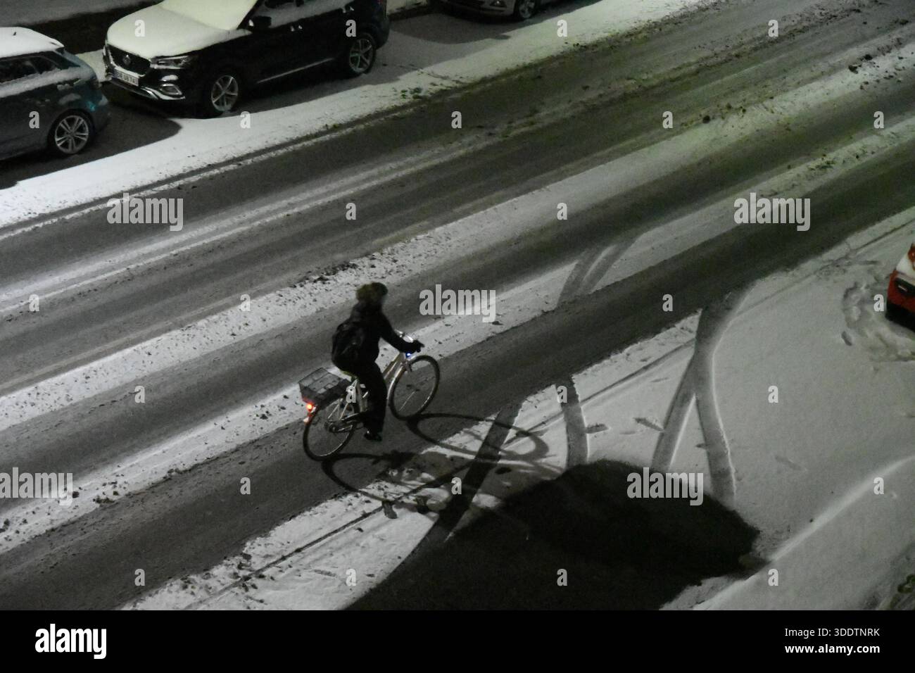 kASTRUP/Copenhagen/ Denmark/03 JAN 2026/Biker in snow fall weather on ...