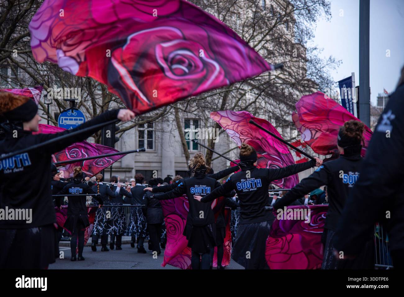 Performers wave colourful flags during the London New Year’s Day Parade ...