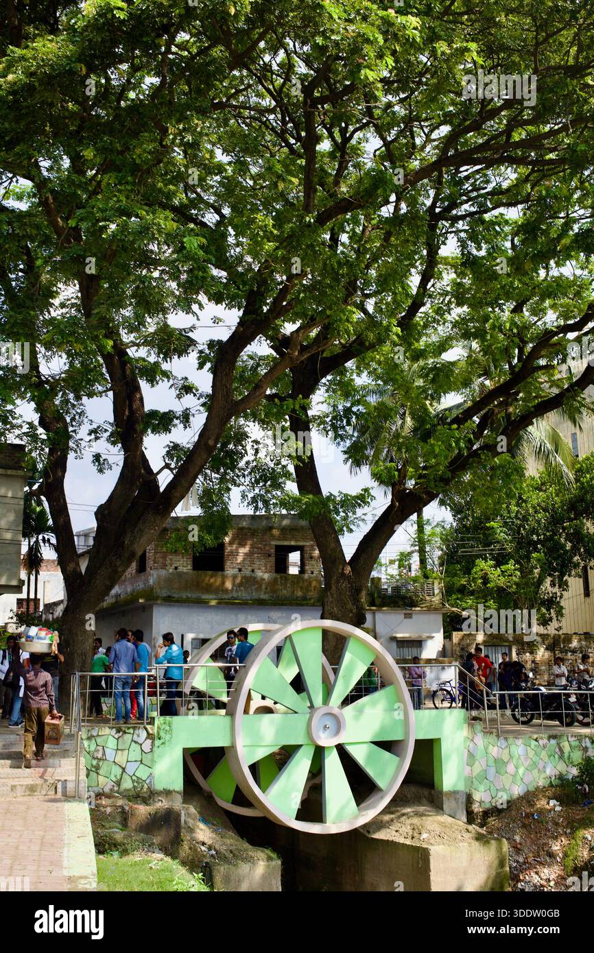Decorative pedestrian bridge with waterwheel feature in Padma Garden ...