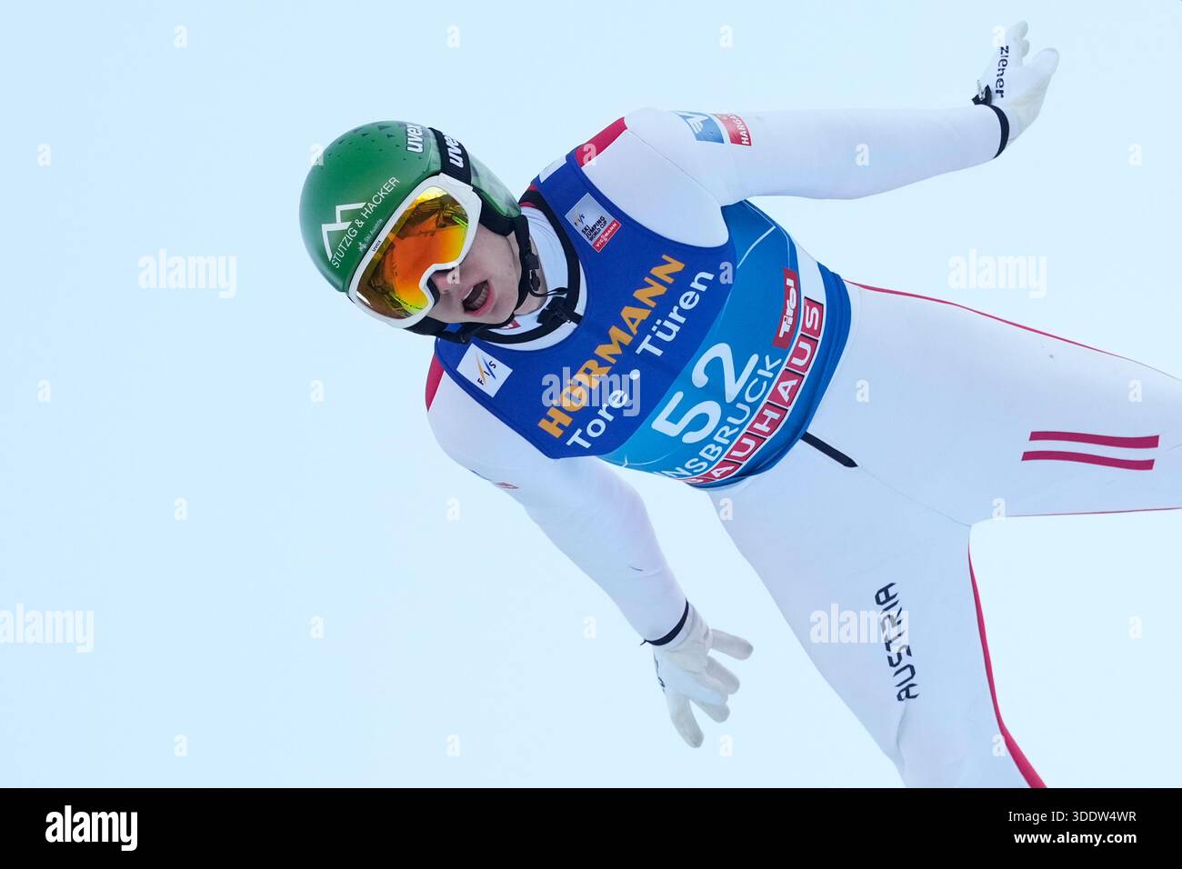 Jonas Schuster, of Austria, soars through the air during his ...