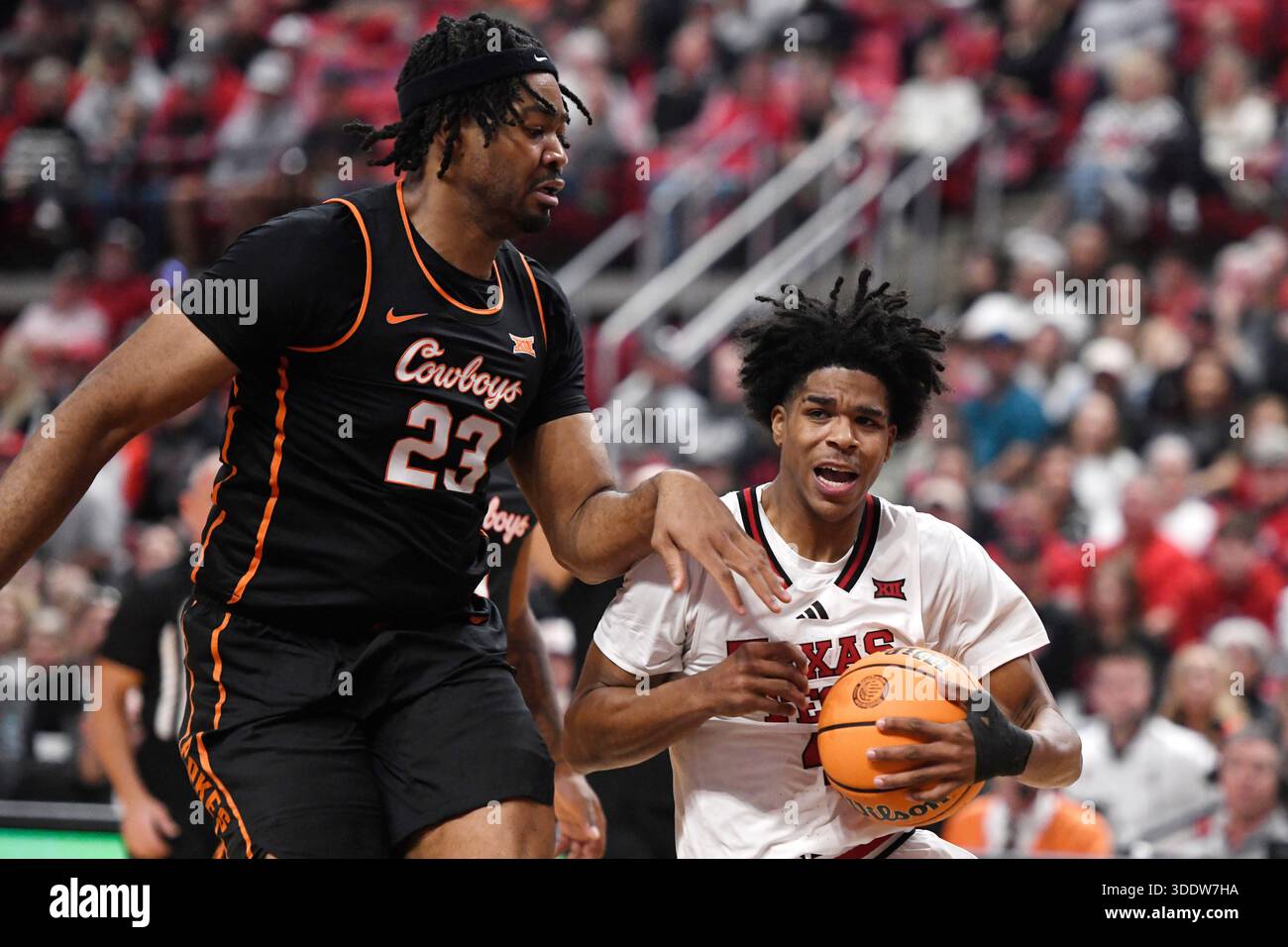 Oklahoma State center Benjamin Ahmed (23) fouls Texas Tech guard ...