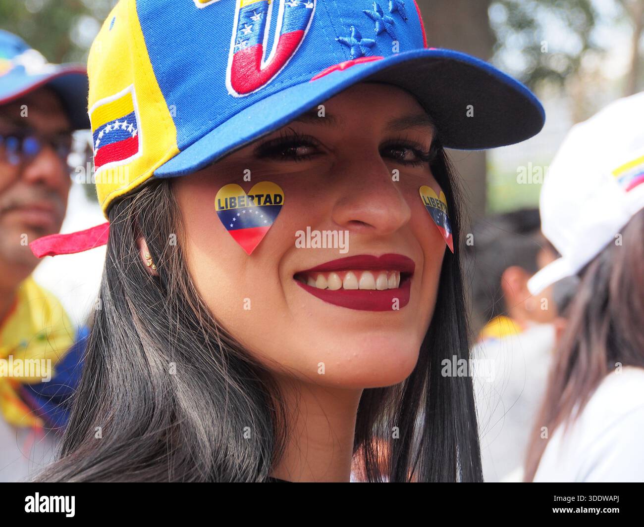 Woman with Venezuelan symbols on her face when dozens of Venezuelans ...