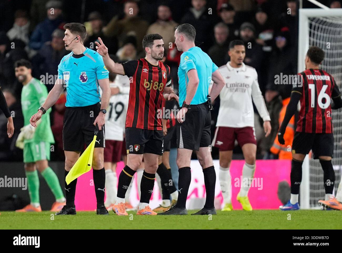 Bournemouth's Lewis Cook speaks with referee Chris Kavanagh after the ...