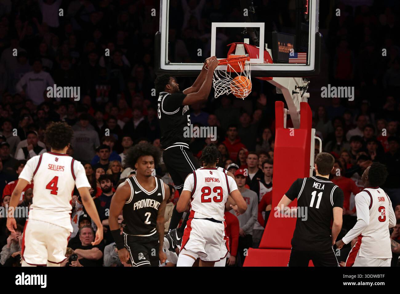 Providence forward Oswin Erhunmwunse dunks the ball in front of St ...