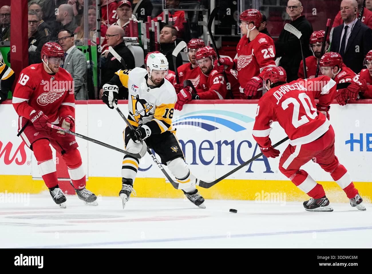 Pittsburgh Penguins center Tommy Novak, center, moves the puck against ...