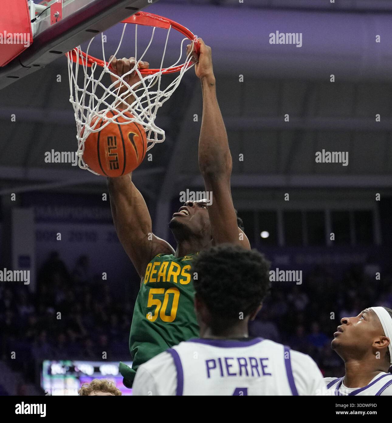 Baylor center James Nnaji (50) dunks the ball ahead of TCU forward ...