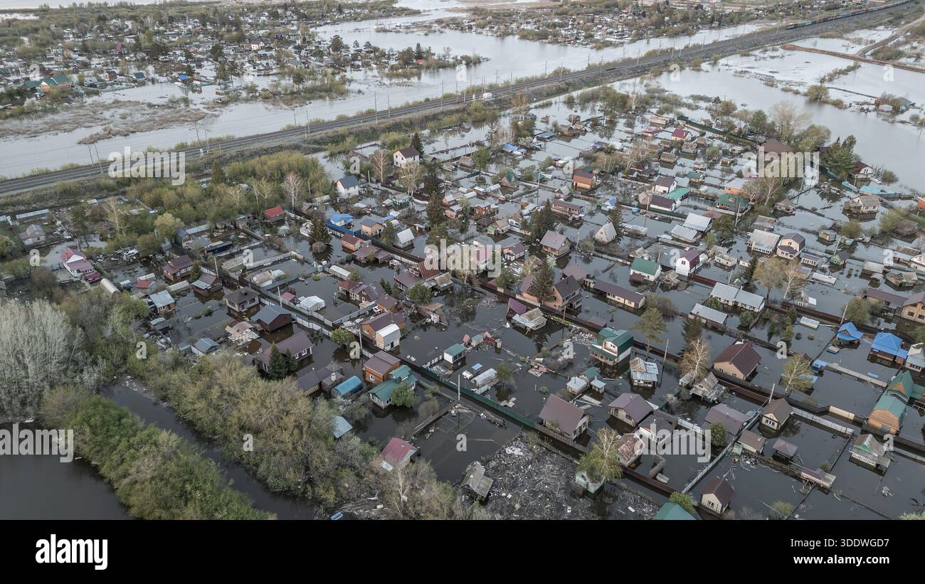 Aerial drone footage of a massive city flood with houses and streets ...
