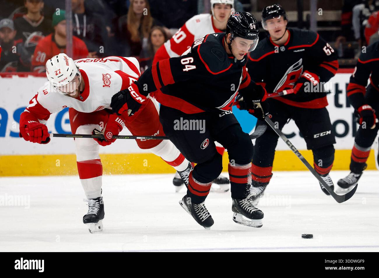 Carolina Hurricanes' Joel Nystrom (64) controls the puck near Detroit ...